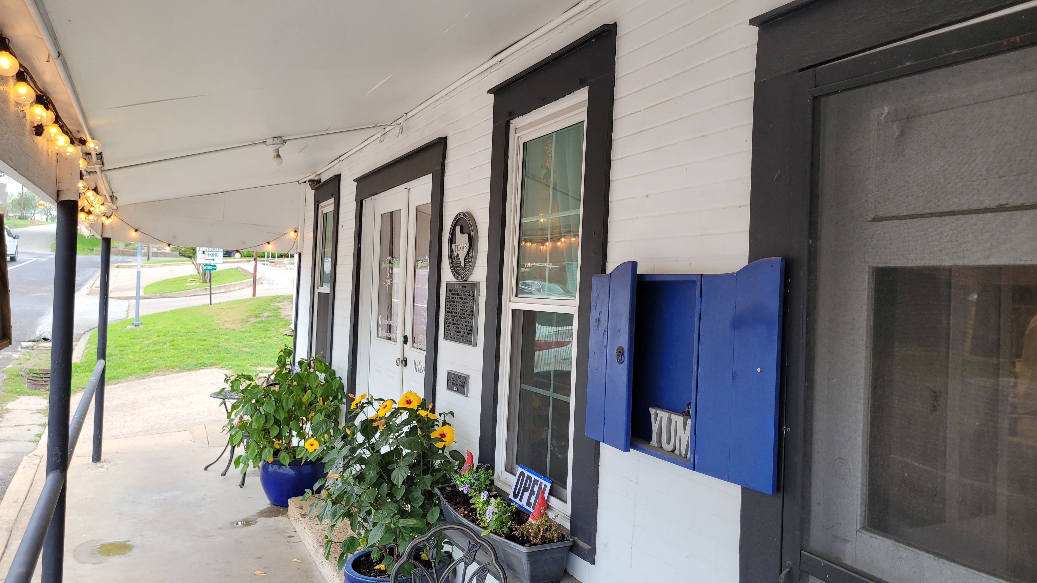 Photo: The front porch of the Burton Cafe with the Marker